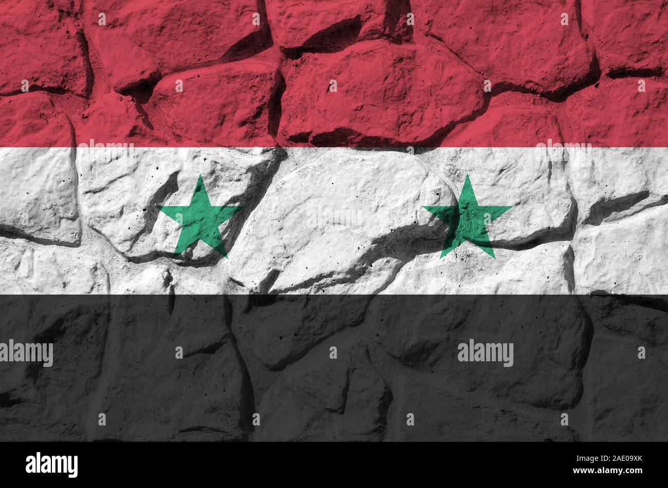 Syria flag depicted in paint colors on old stone wall close up ...