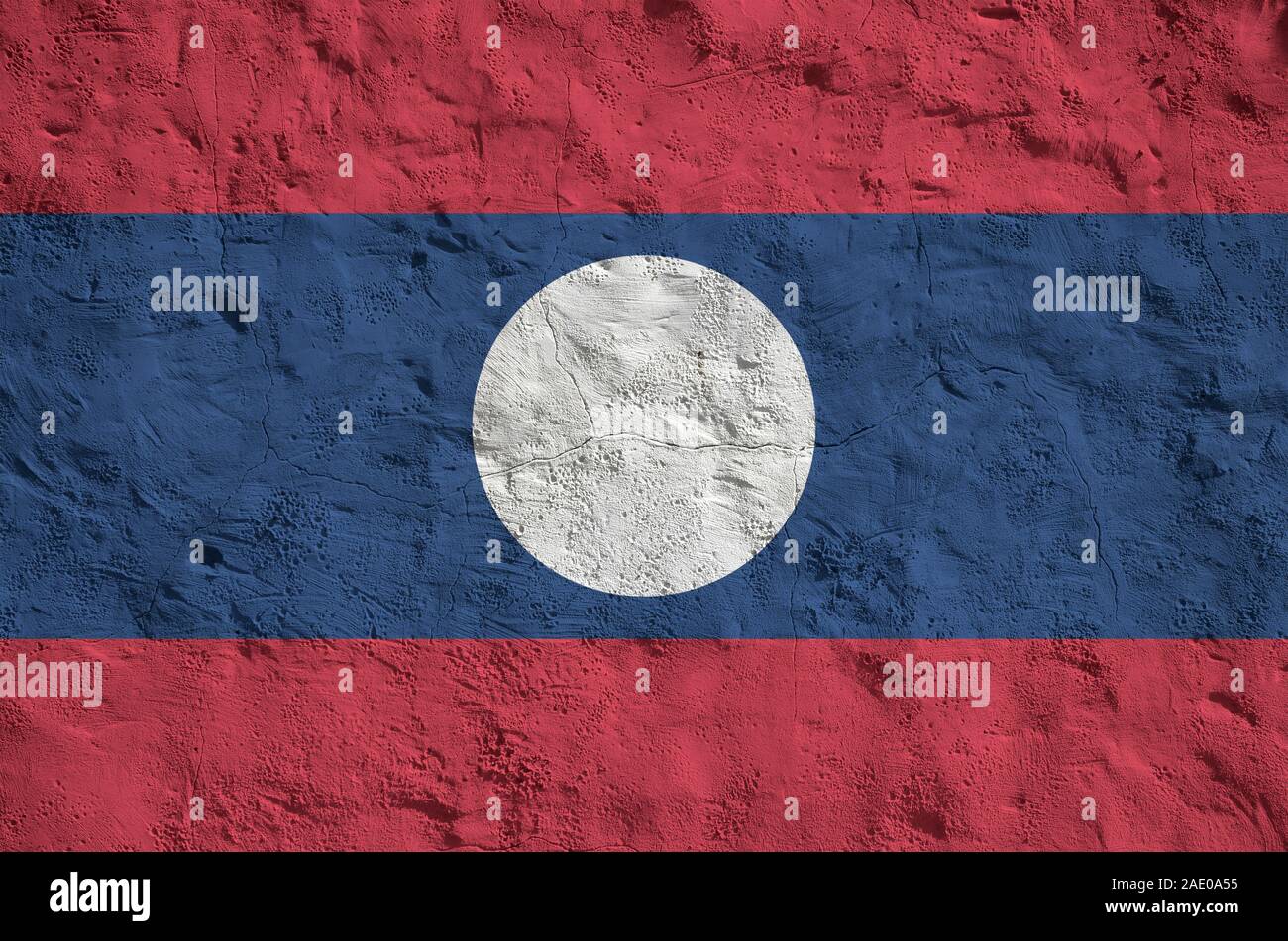 Laos flag depicted in bright paint colors on old relief plastering wall ...
