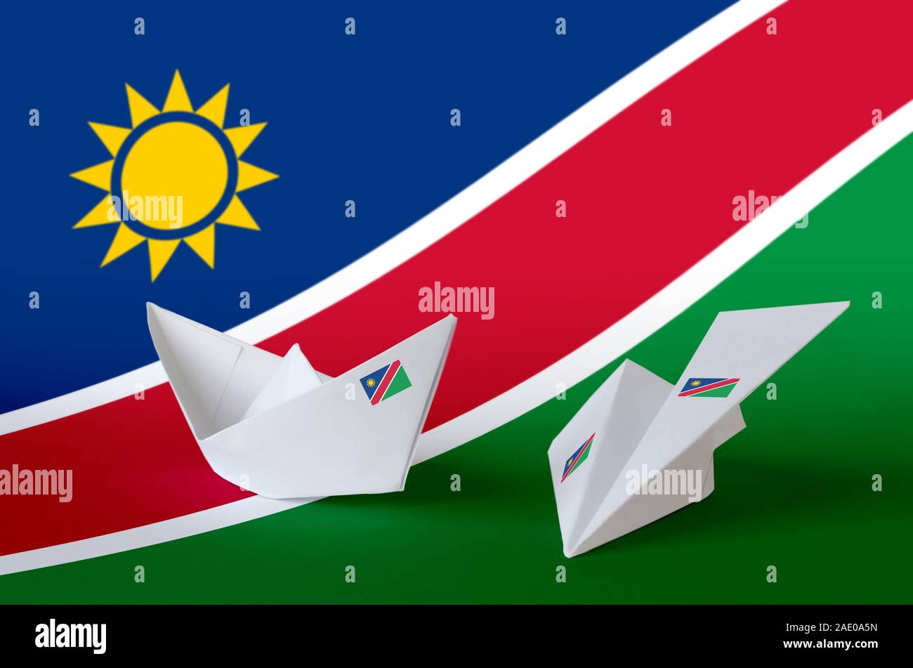 Namibia flag depicted on paper origami airplane and boat. Oriental ...