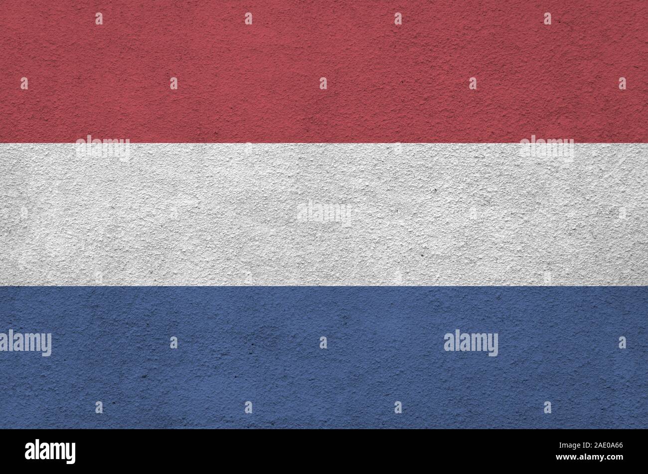 Netherlands flag depicted in bright paint colors on old relief ...