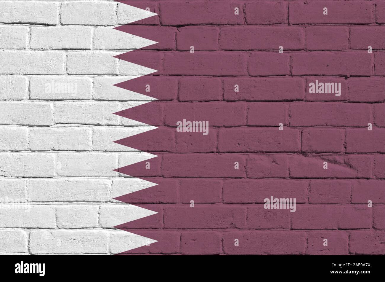 Qatar flag depicted in paint colors on old brick wall close up ...