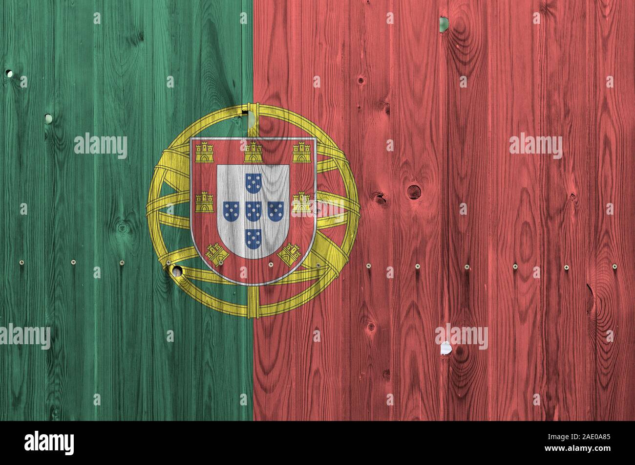 Portugal flag depicted in bright paint colors on old wooden wall close ...