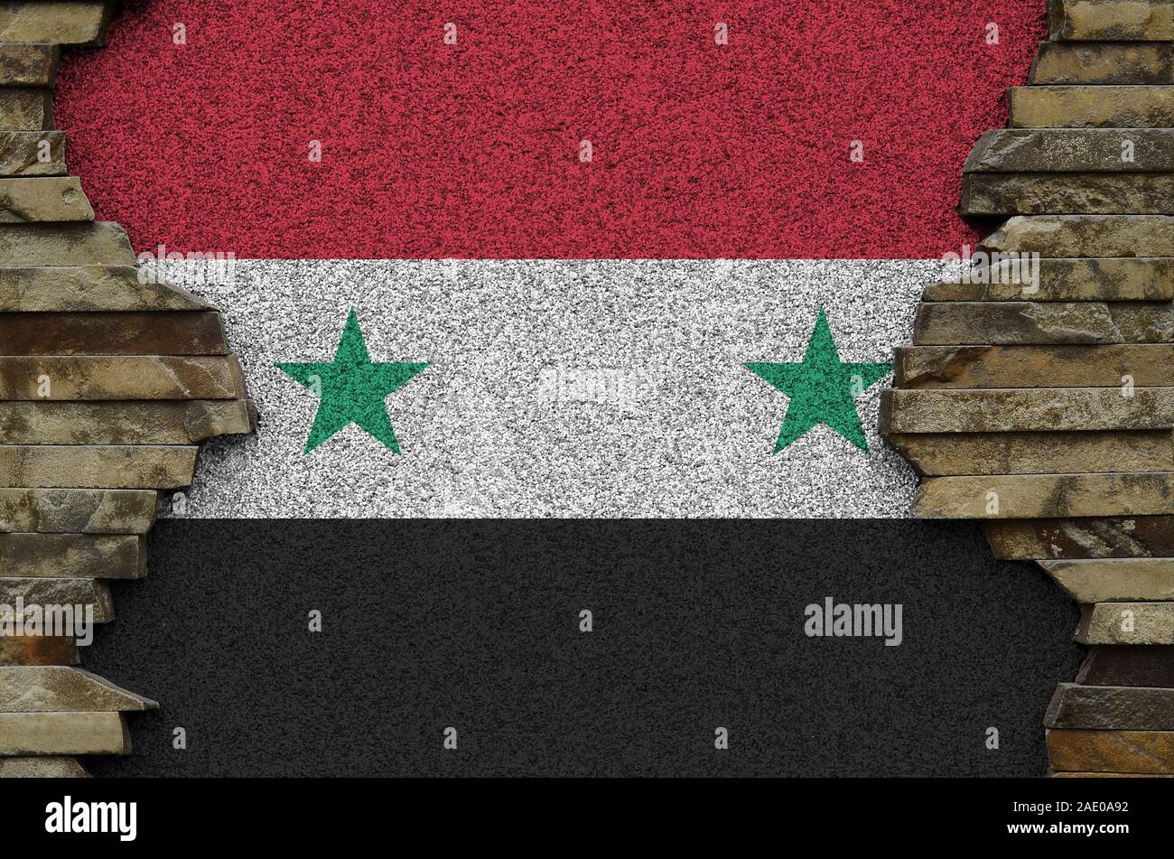 Syria flag depicted in paint colors on old stone wall close up ...