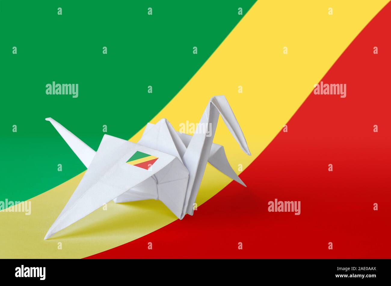 Congo flag depicted on paper origami crane wing. Oriental handmade arts ...