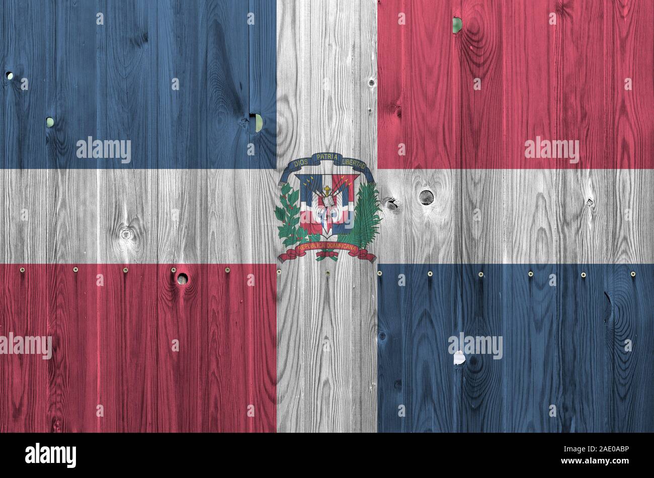 Dominican Republic flag depicted in bright paint colors on old wooden ...