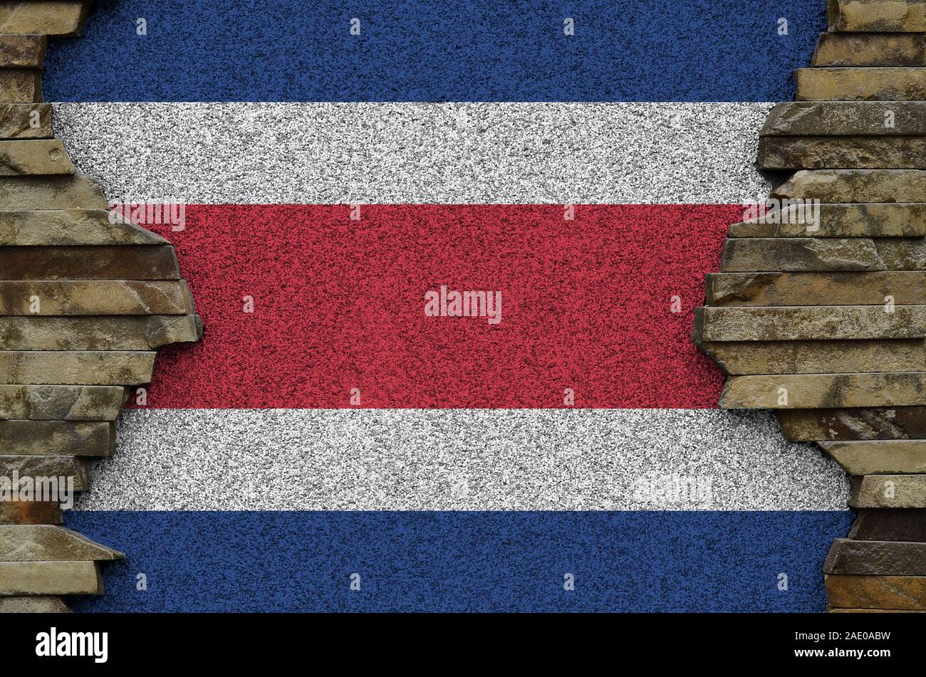 Costa Rica flag depicted in paint colors on old stone wall close up ...
