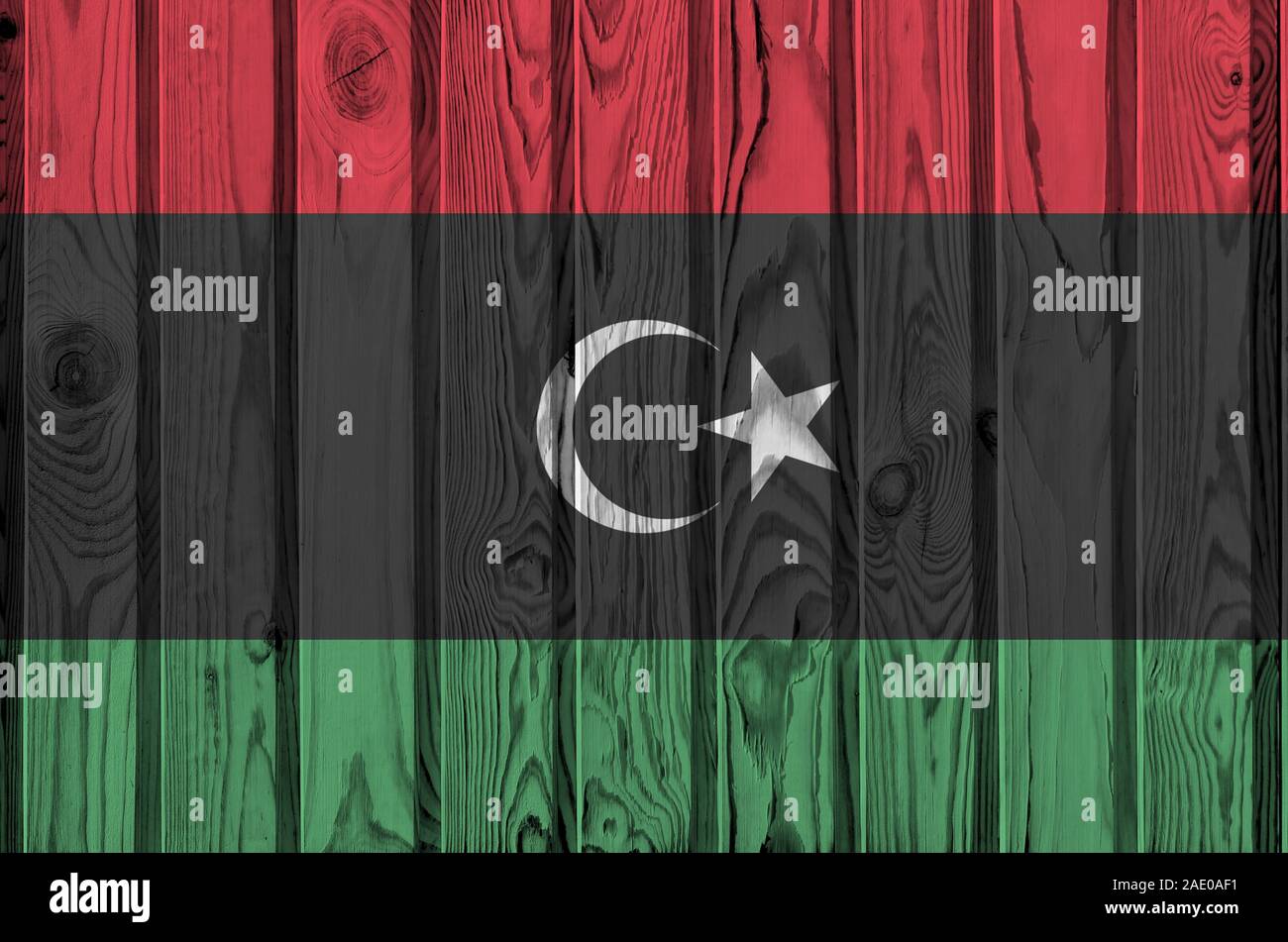 Libya flag depicted in bright paint colors on old wooden wall close up ...