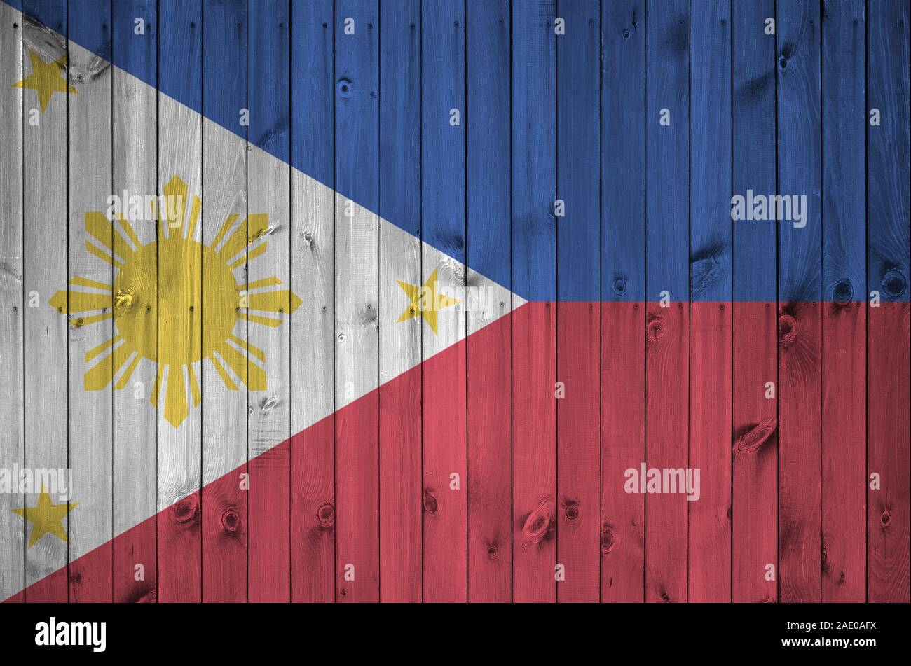Philippines flag depicted in bright paint colors on old wooden wall ...