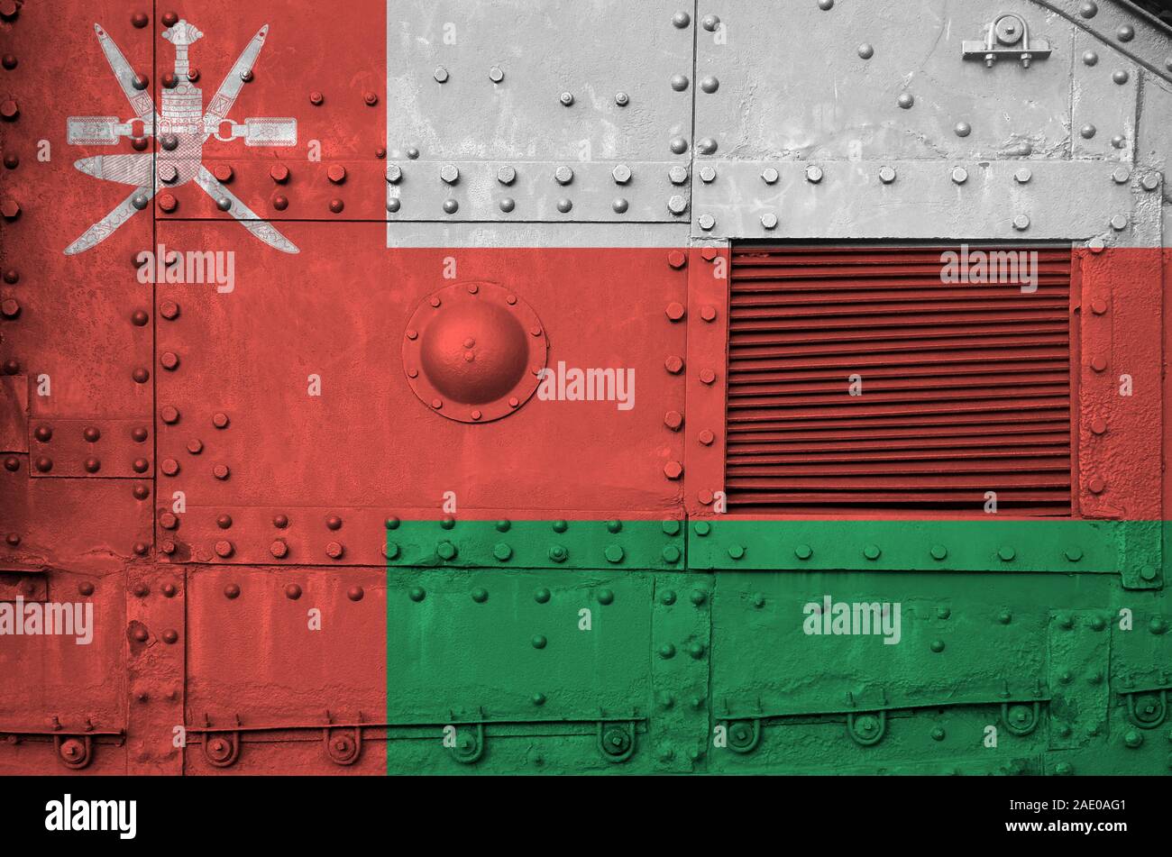 Oman flag depicted on side part of military armored tank close up. Army ...