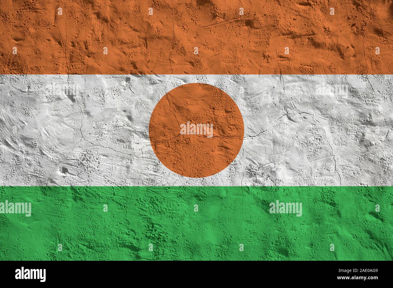 Niger flag depicted in bright paint colors on old relief plastering ...