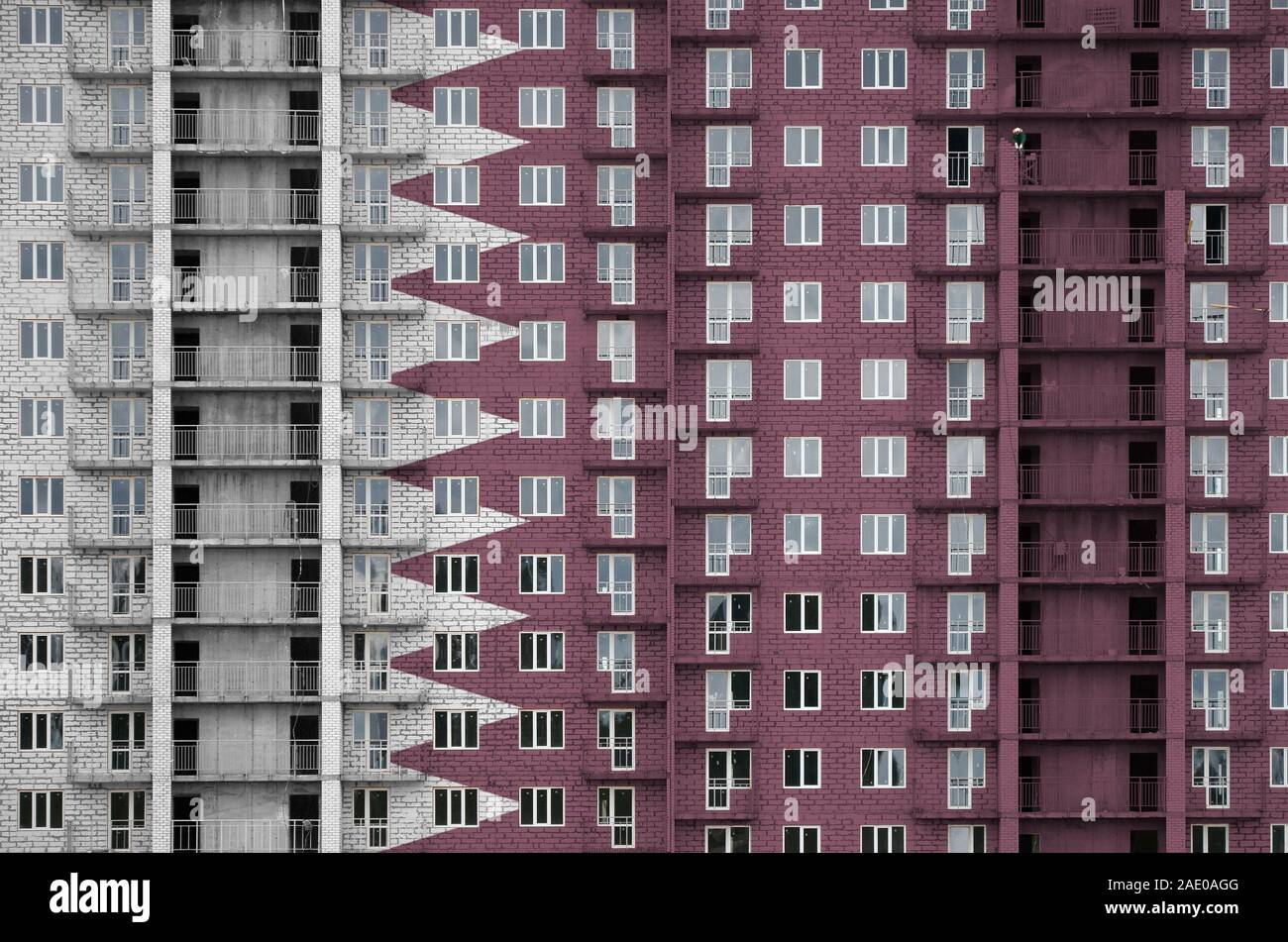 Qatar flag depicted in paint colors on multi-storey residental building ...