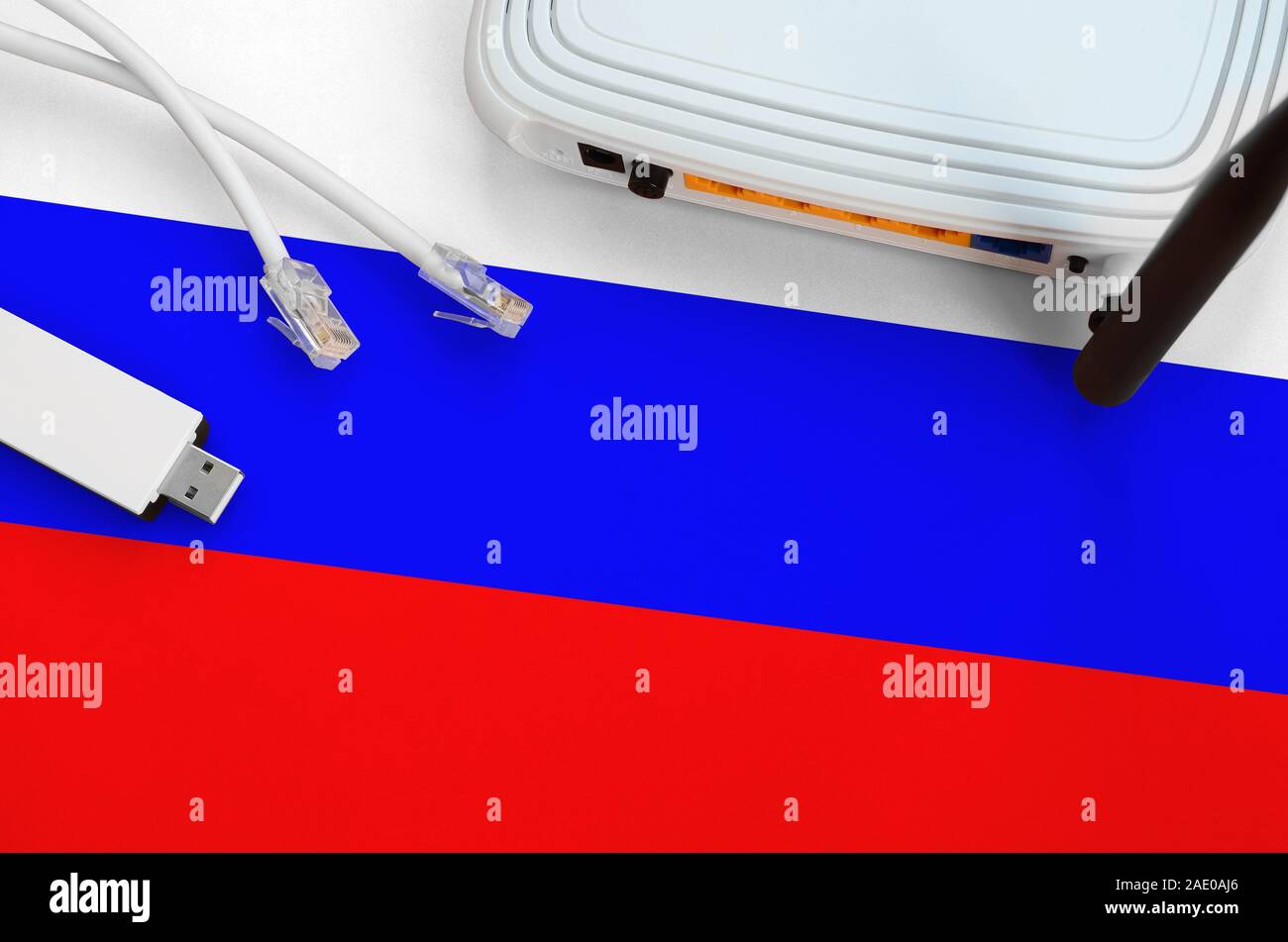 Russia flag depicted on table with internet rj45 cable, wireless usb wi ...