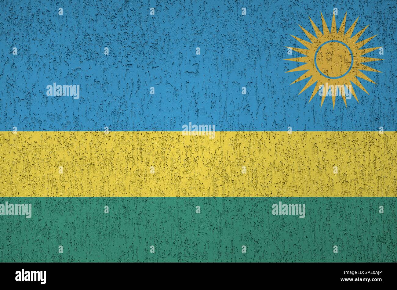 Rwanda flag depicted in bright paint colors on old relief plastering ...