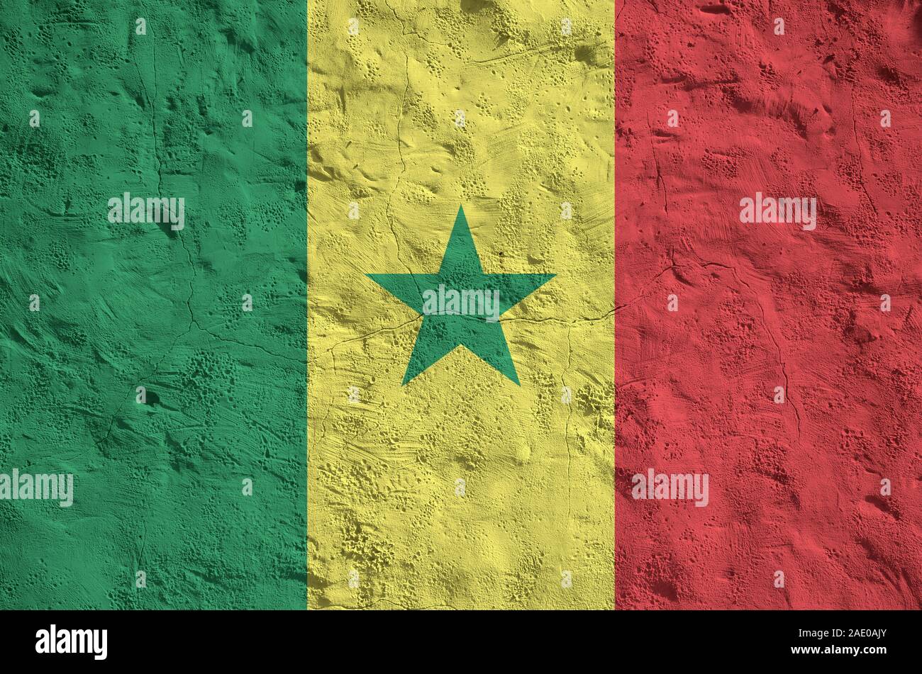 Senegal flag depicted in bright paint colors on old relief plastering ...