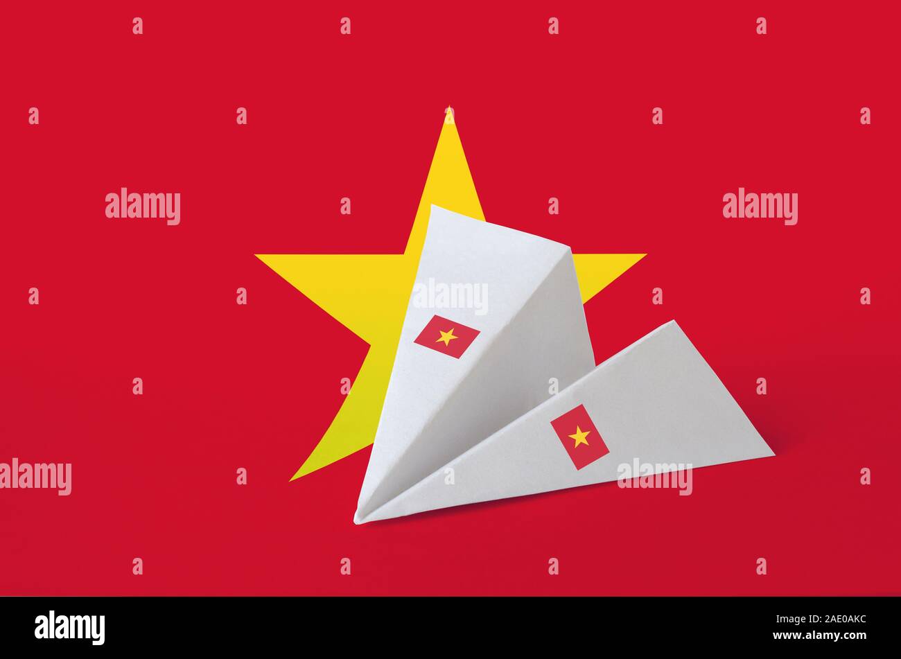 Vietnam flag depicted on paper origami airplane. Oriental handmade arts ...
