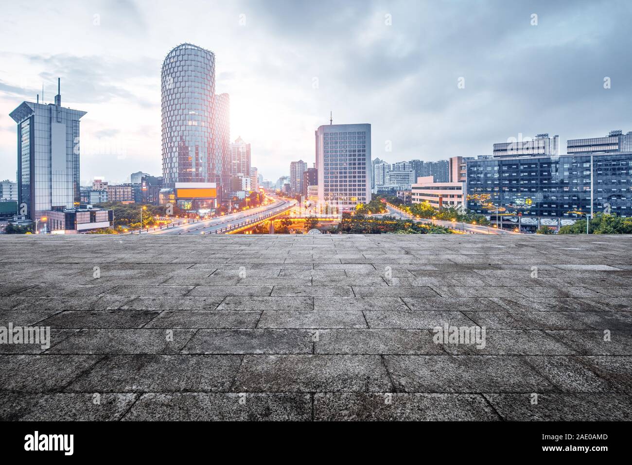 Asphalt road in front of city skyline Stock Photo - Alamy