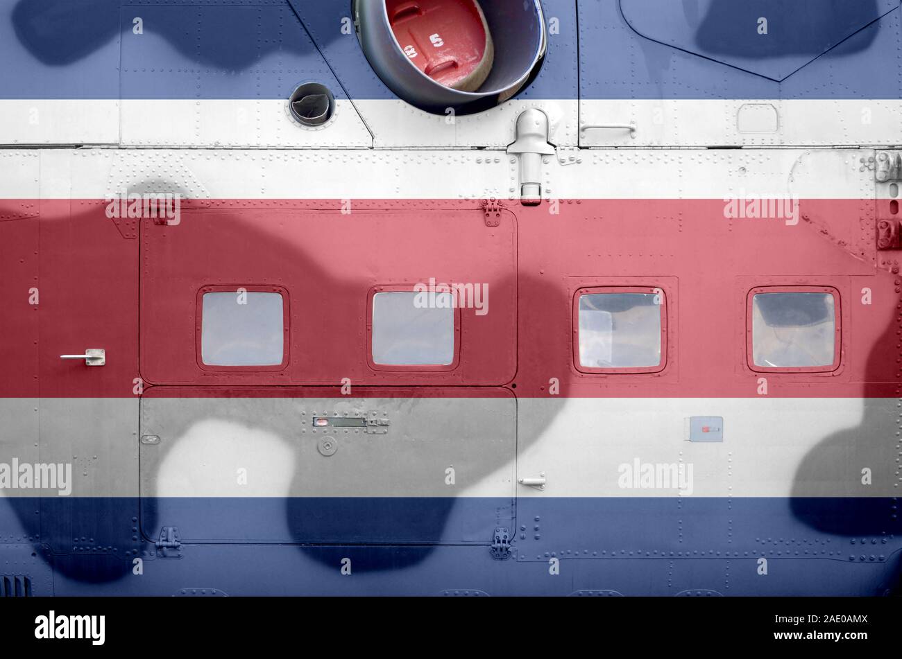 Costa Rica flag depicted on side part of military armored helicopter ...