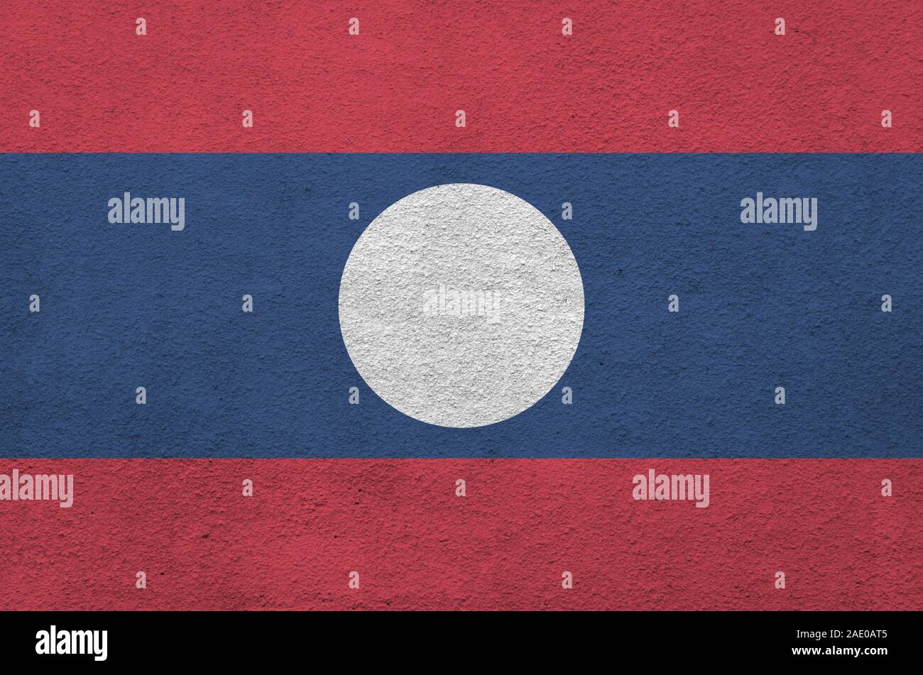 Laos flag depicted in bright paint colors on old relief plastering wall ...