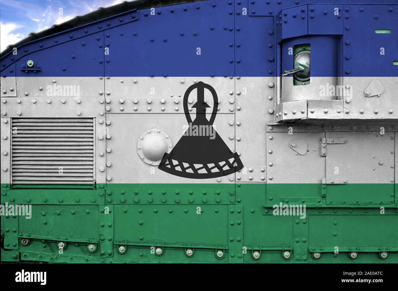 Lesotho flag depicted on side part of military armored tank close up ...