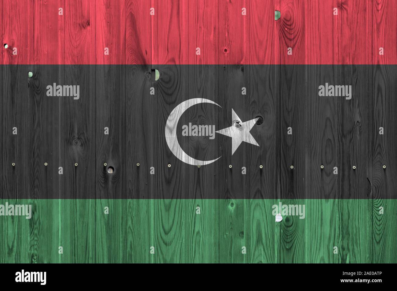 Libya flag depicted in bright paint colors on old wooden wall close up ...