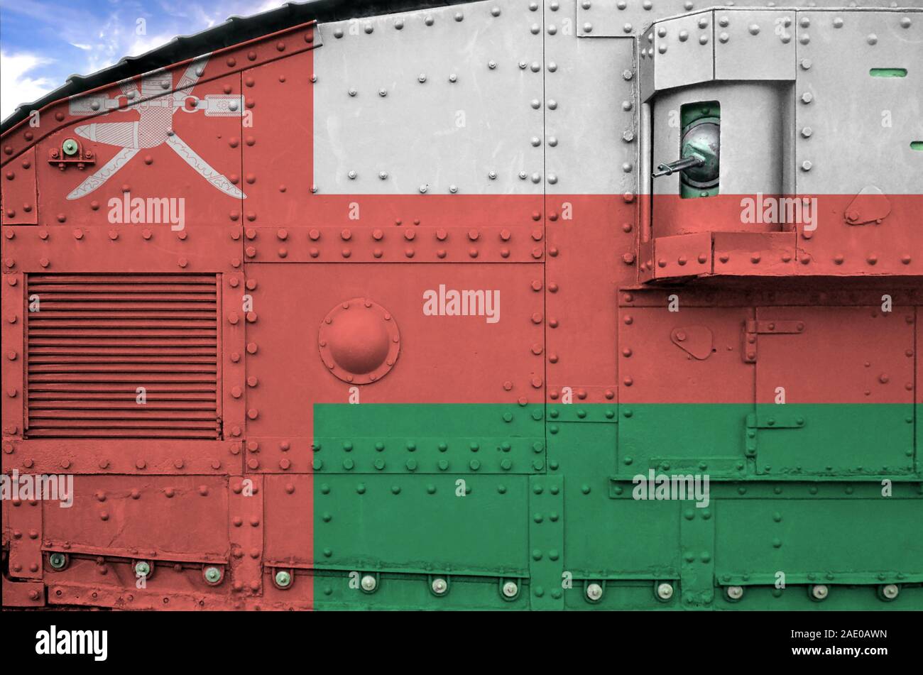 Oman flag depicted on side part of military armored tank close up. Army ...