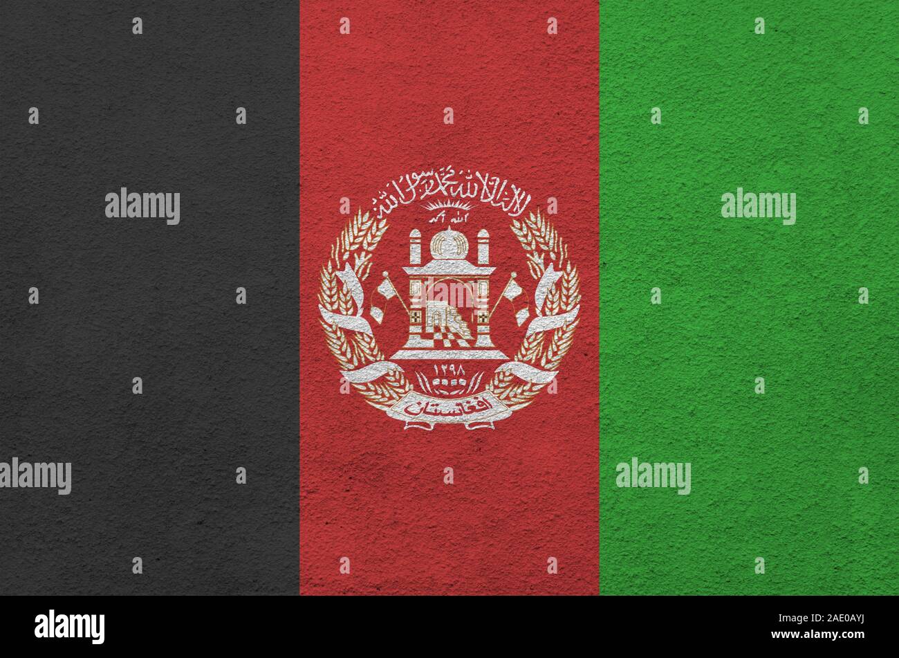 Afghanistan flag depicted in bright paint colors on old relief ...