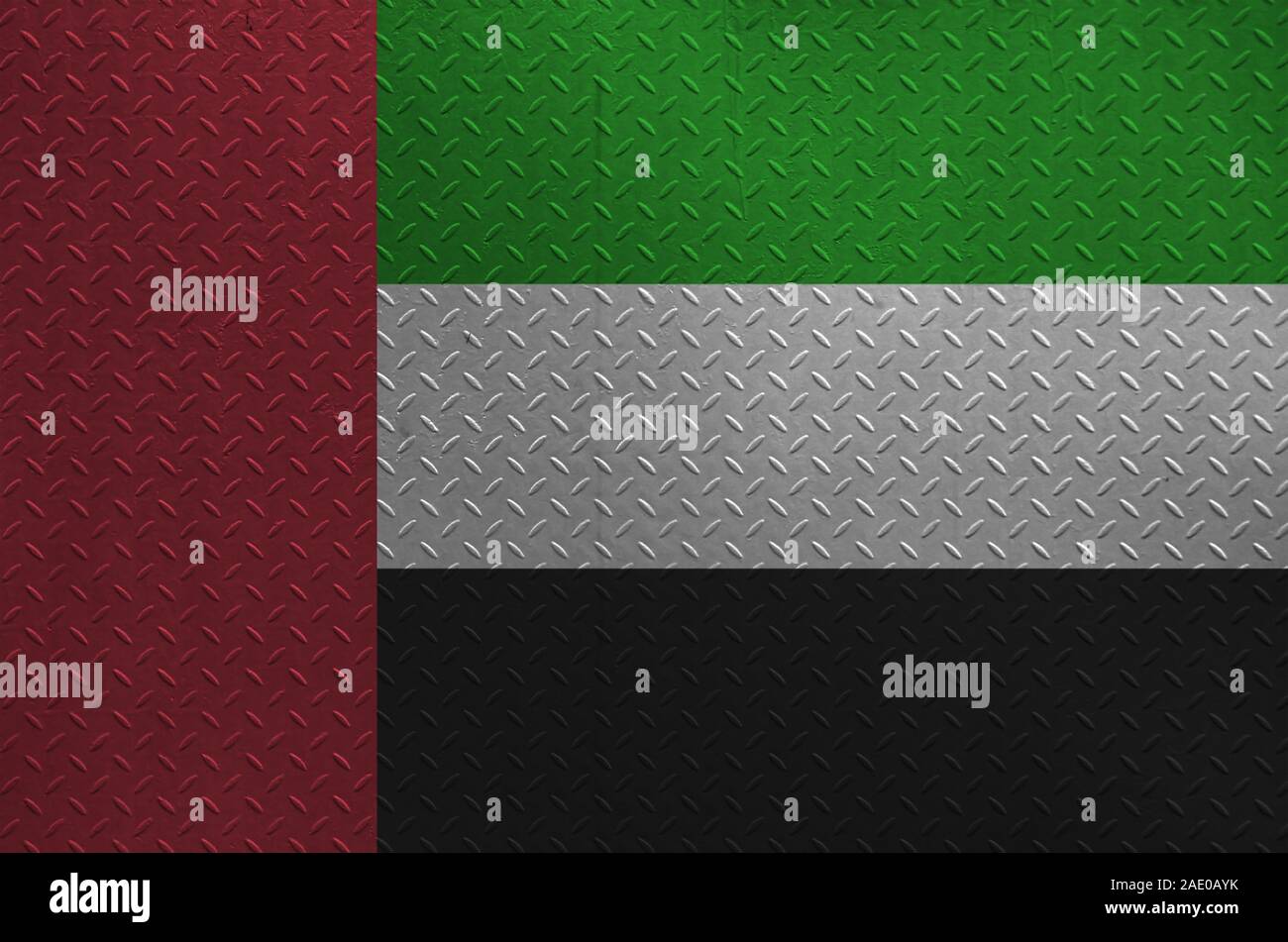 United Arab Emirates flag depicted in paint colors on old brushed metal ...