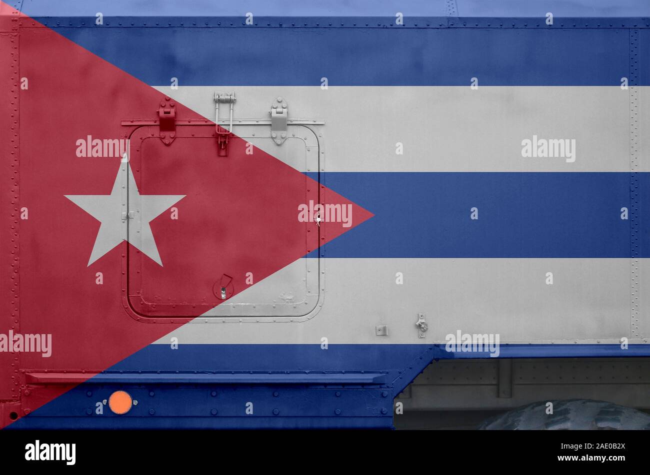 Cuba flag depicted on side part of military armored truck close up ...