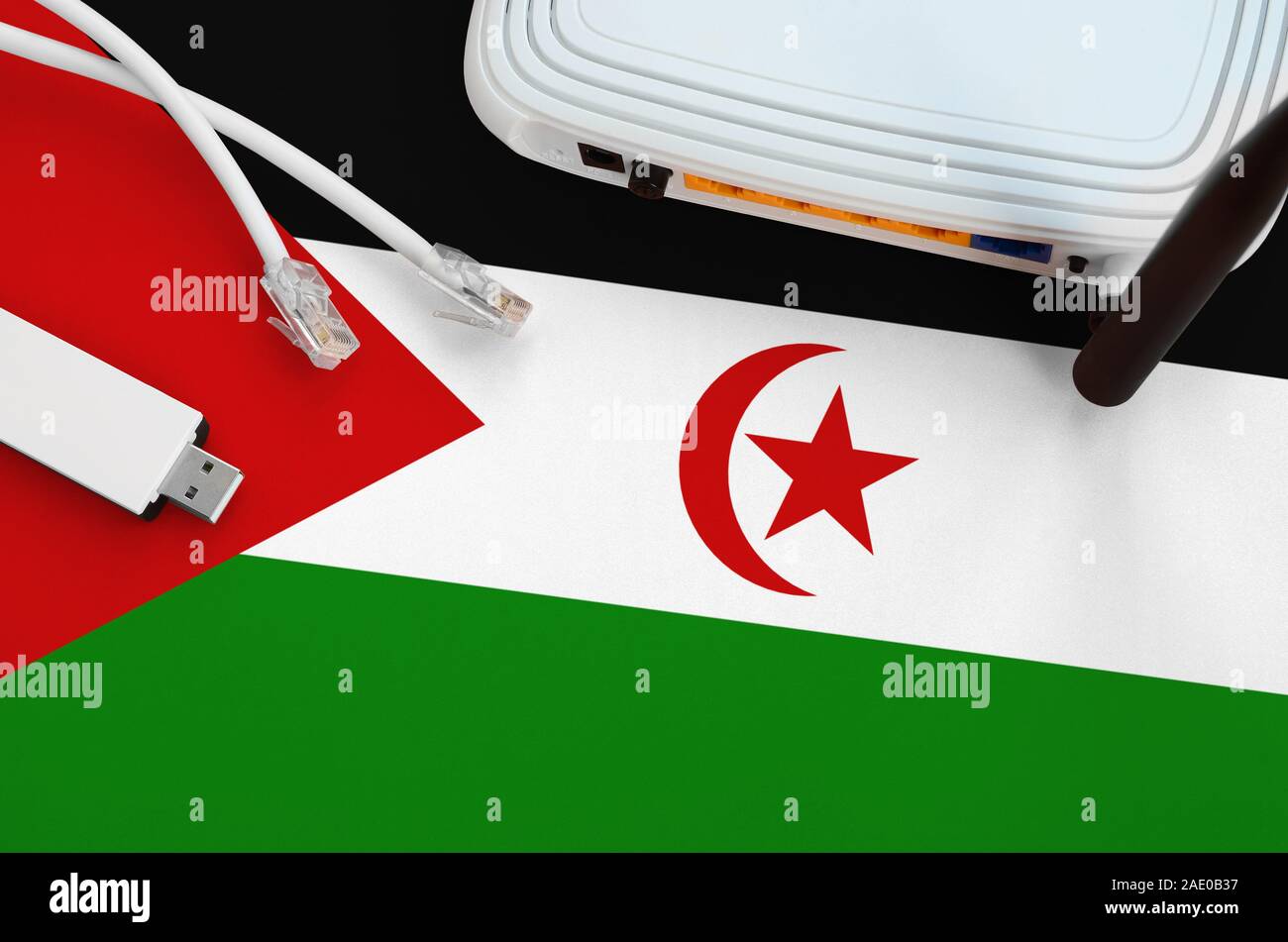 Western Sahara flag depicted on table with internet rj45 cable ...