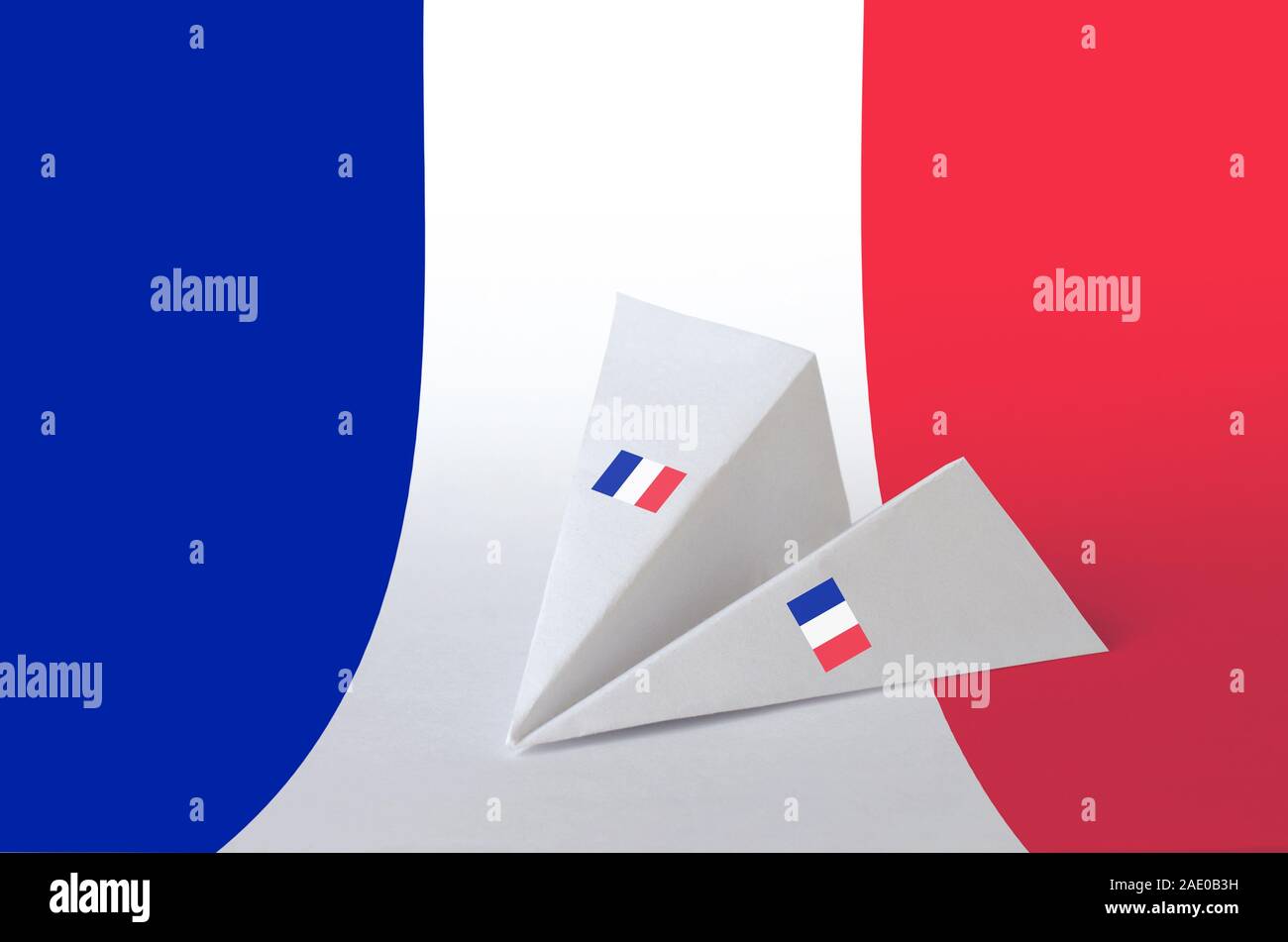 France flag depicted on paper origami airplane. Oriental handmade arts ...