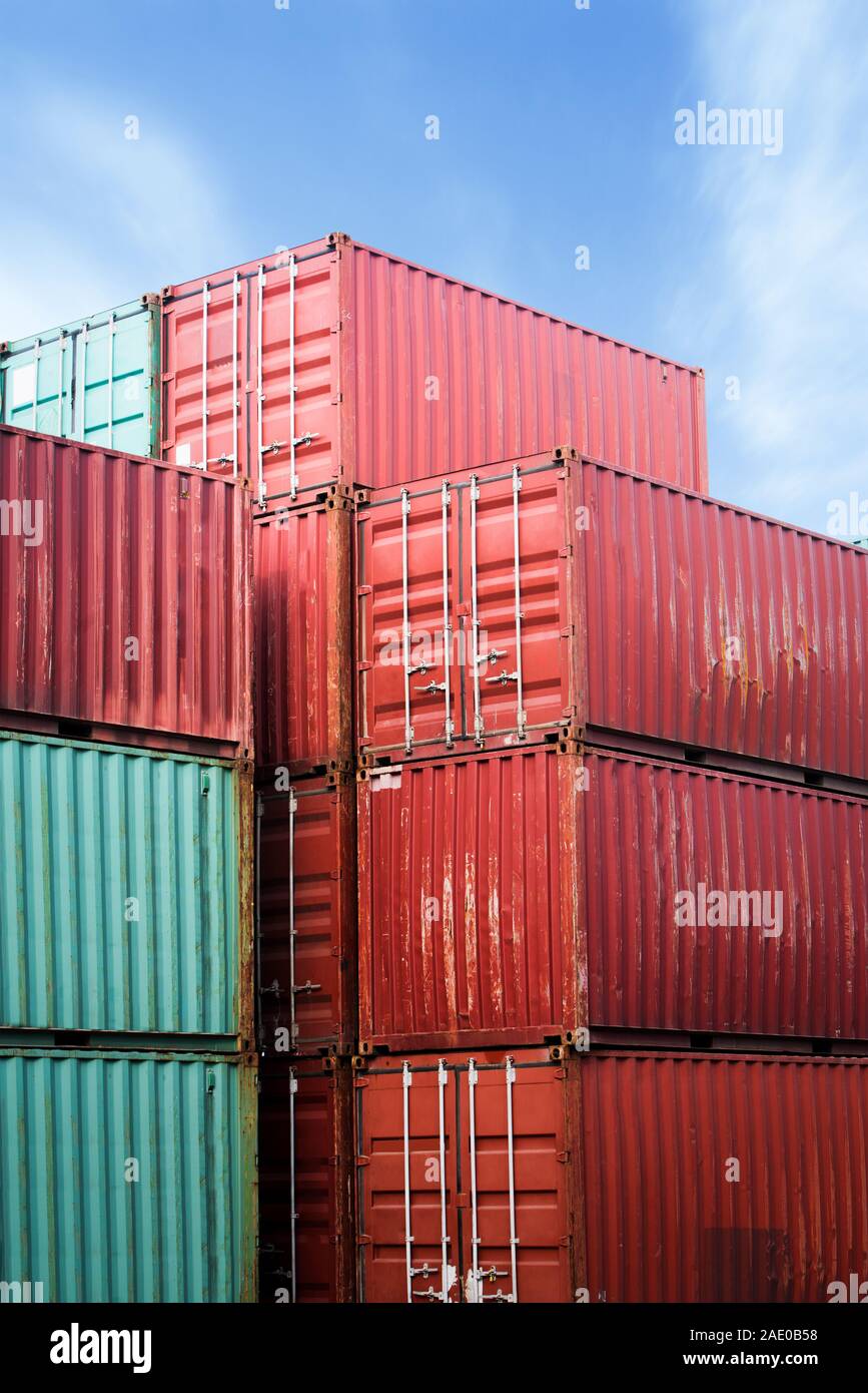 Forklift truck lifting cargo container in shipping yard or dock yard ...