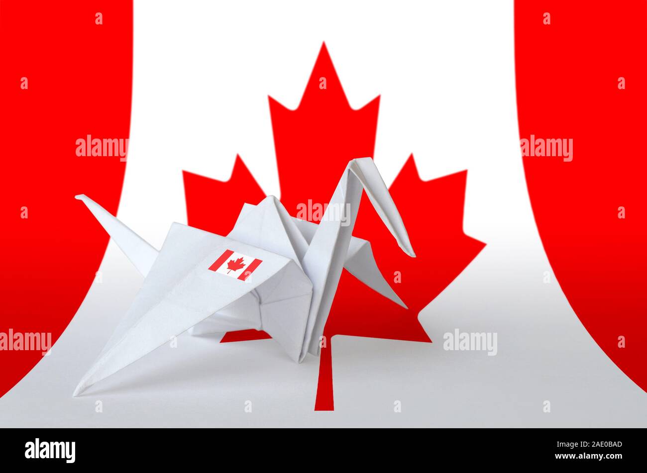 Canada flag depicted on paper origami crane wing. Oriental handmade ...