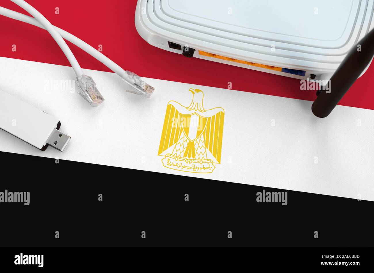 Egypt flag depicted on table with internet rj45 cable, wireless usb wi ...