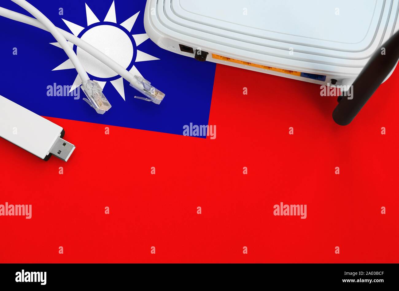 Taiwan flag depicted on table with internet rj45 cable, wireless usb wi ...