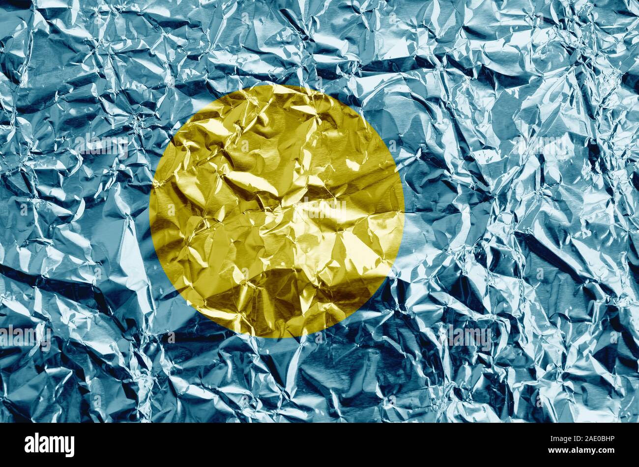 Palau flag depicted in paint colors on shiny crumpled aluminium foil ...