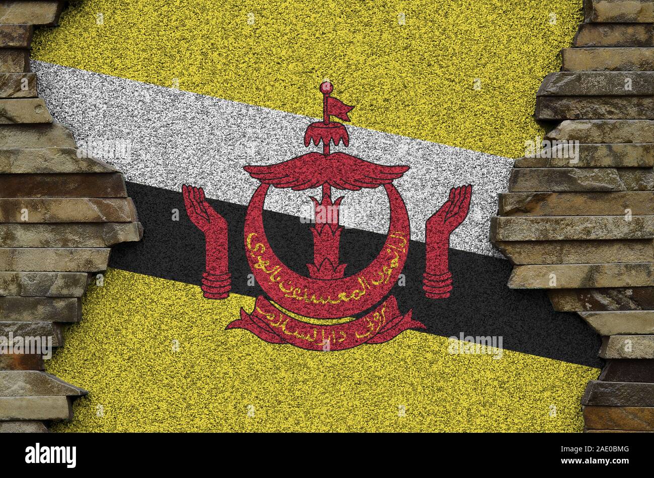 Brunei Darussalam flag depicted in paint colors on old stone wall close ...