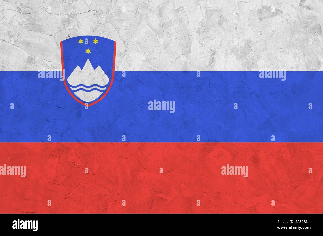Slovenia flag depicted in bright paint colors on old relief plastering ...