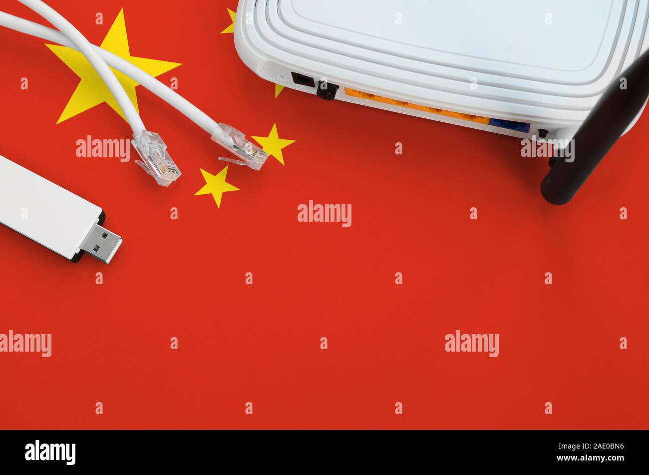 China flag depicted on table with internet rj45 cable, wireless usb wi ...