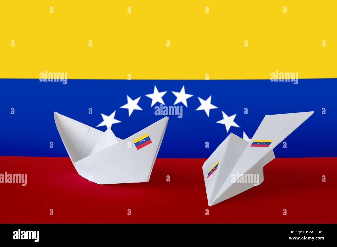 Venezuela flag depicted on paper origami airplane and boat. Oriental ...