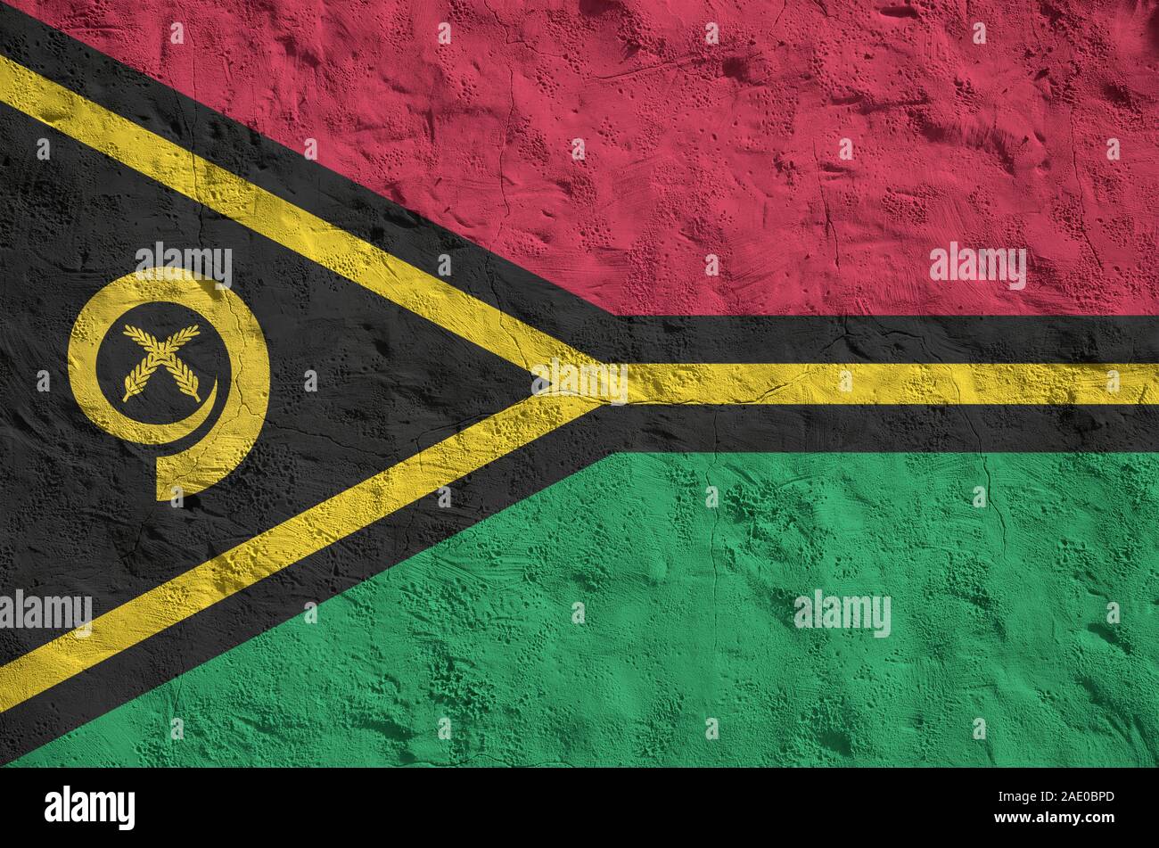 Vanuatu flag depicted in bright paint colors on old relief plastering ...