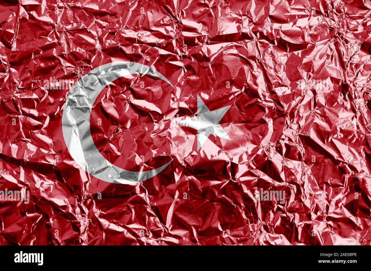Turkey flag depicted in paint colors on shiny crumpled aluminium foil ...