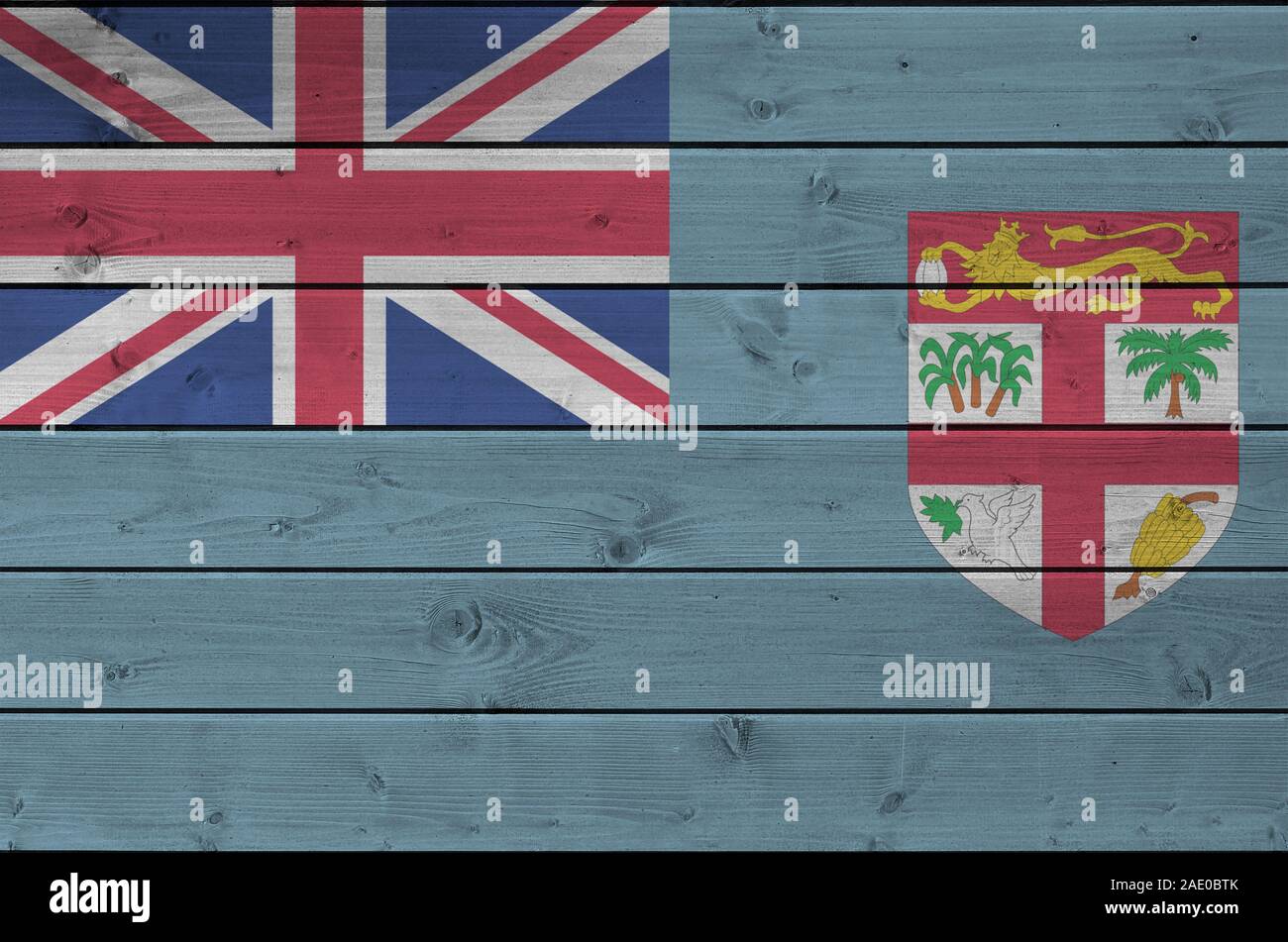Fiji flag depicted in bright paint colors on old wooden wall close up ...