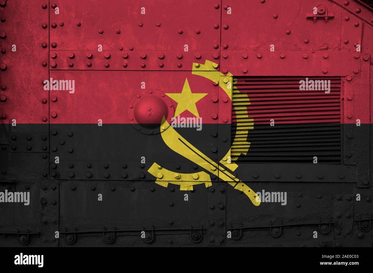Angola flag depicted on side part of military armored tank close up ...