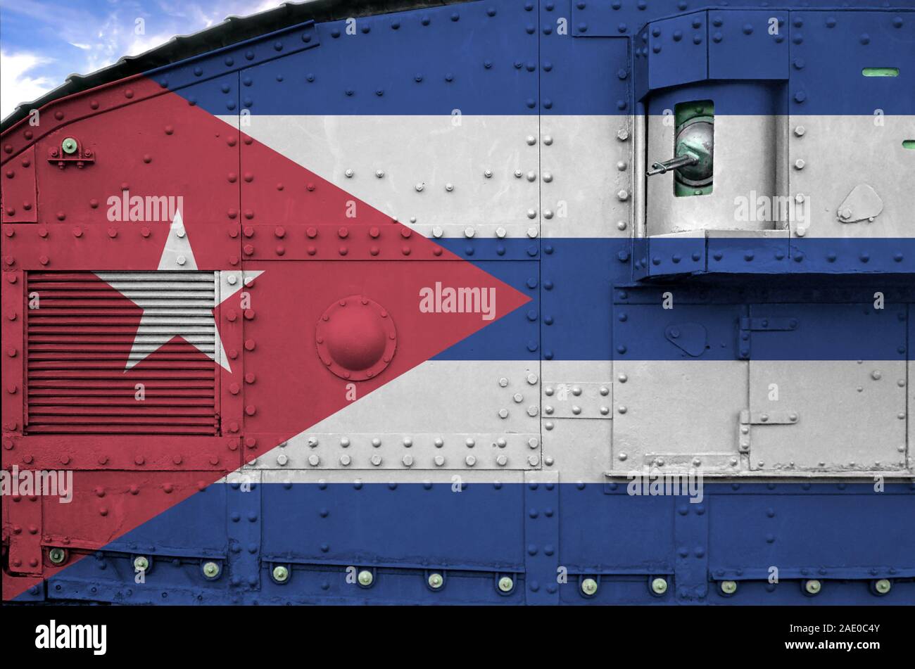 Cuba flag depicted on side part of military armored tank close up. Army ...