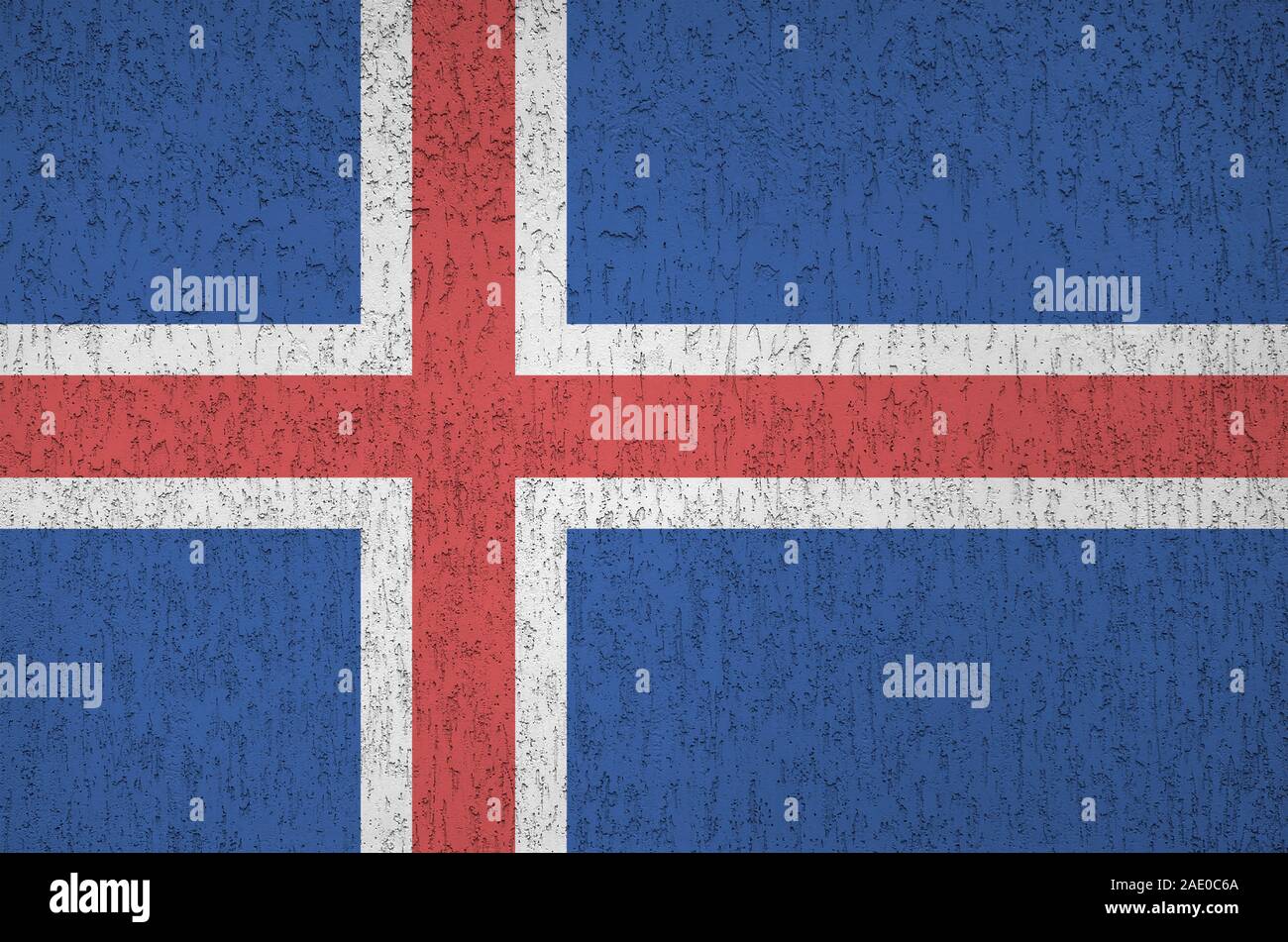 Iceland flag depicted in bright paint colors on old relief plastering ...
