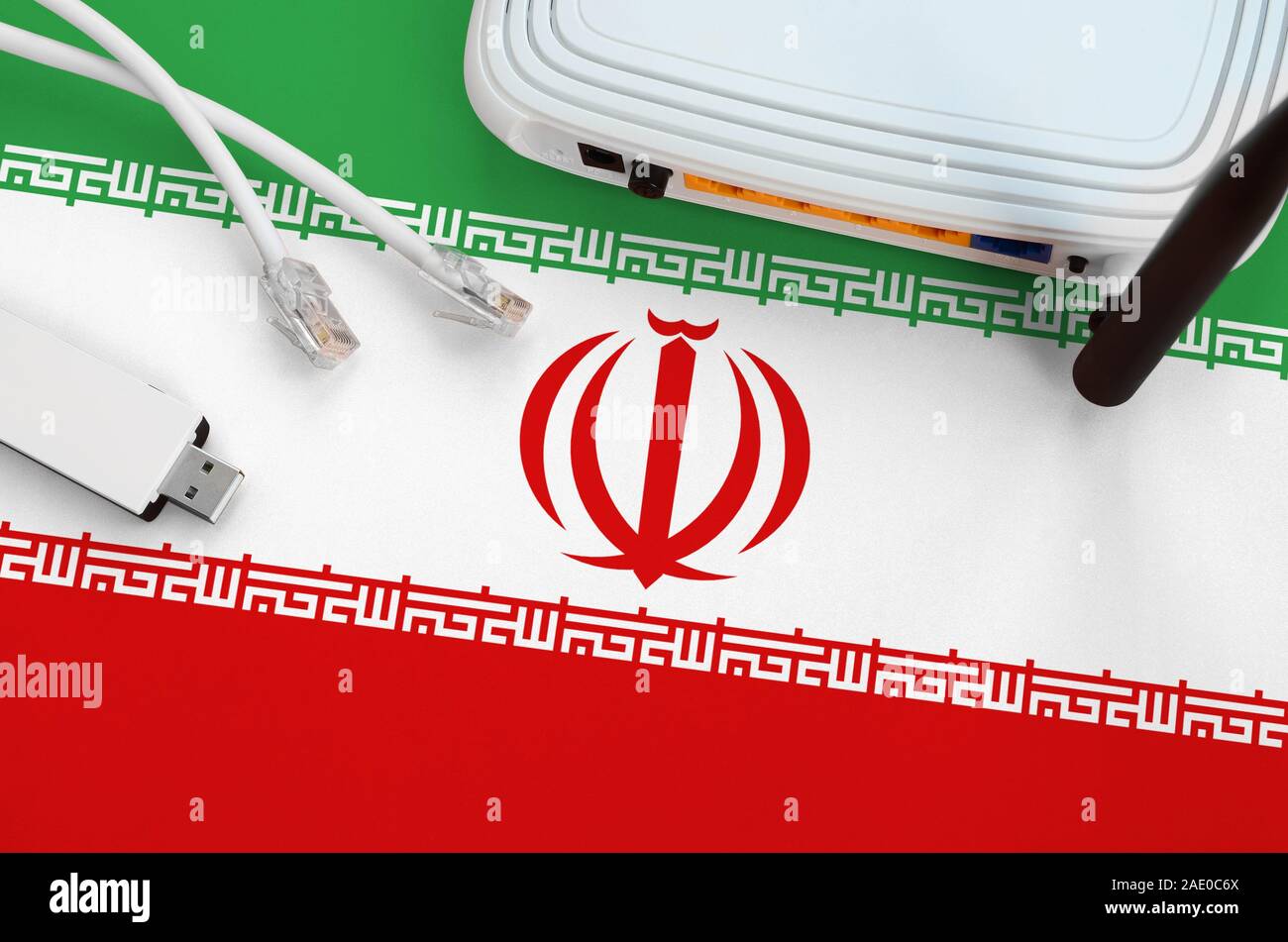 Iran flag depicted on table with internet rj45 cable, wireless usb wi ...