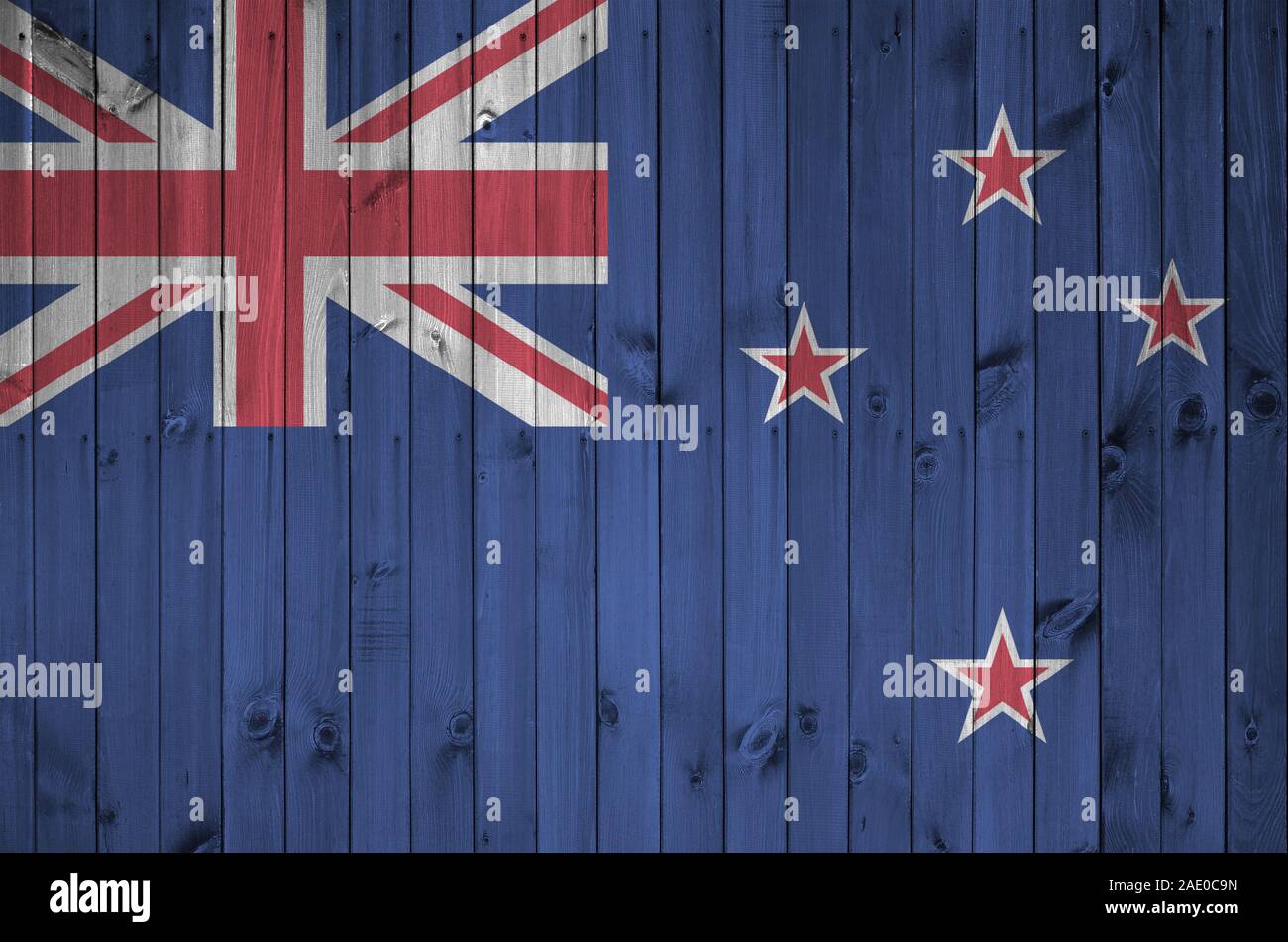 New Zealand flag depicted in bright paint colors on old wooden wall ...