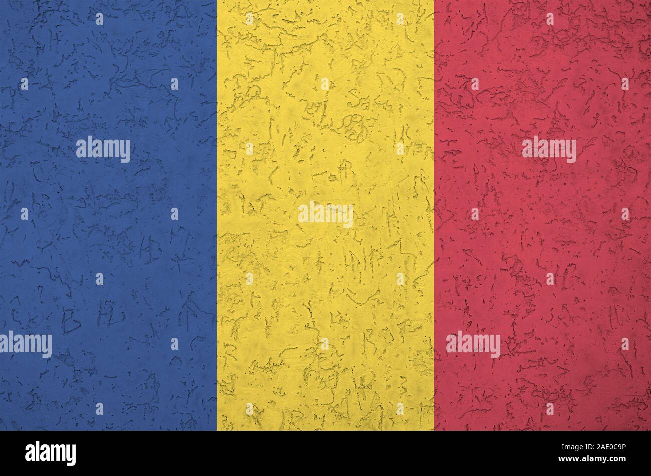 Romania flag depicted in bright paint colors on old relief plastering ...