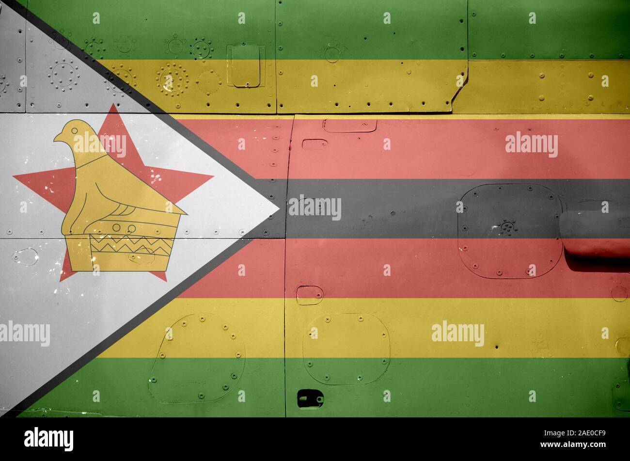 Zimbabwe flag depicted on side part of military armored helicopter ...