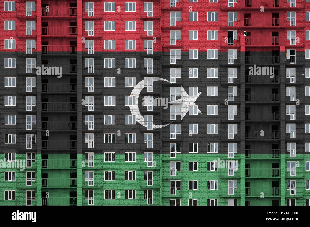 Libya flag depicted in paint colors on multi-storey residental building ...
